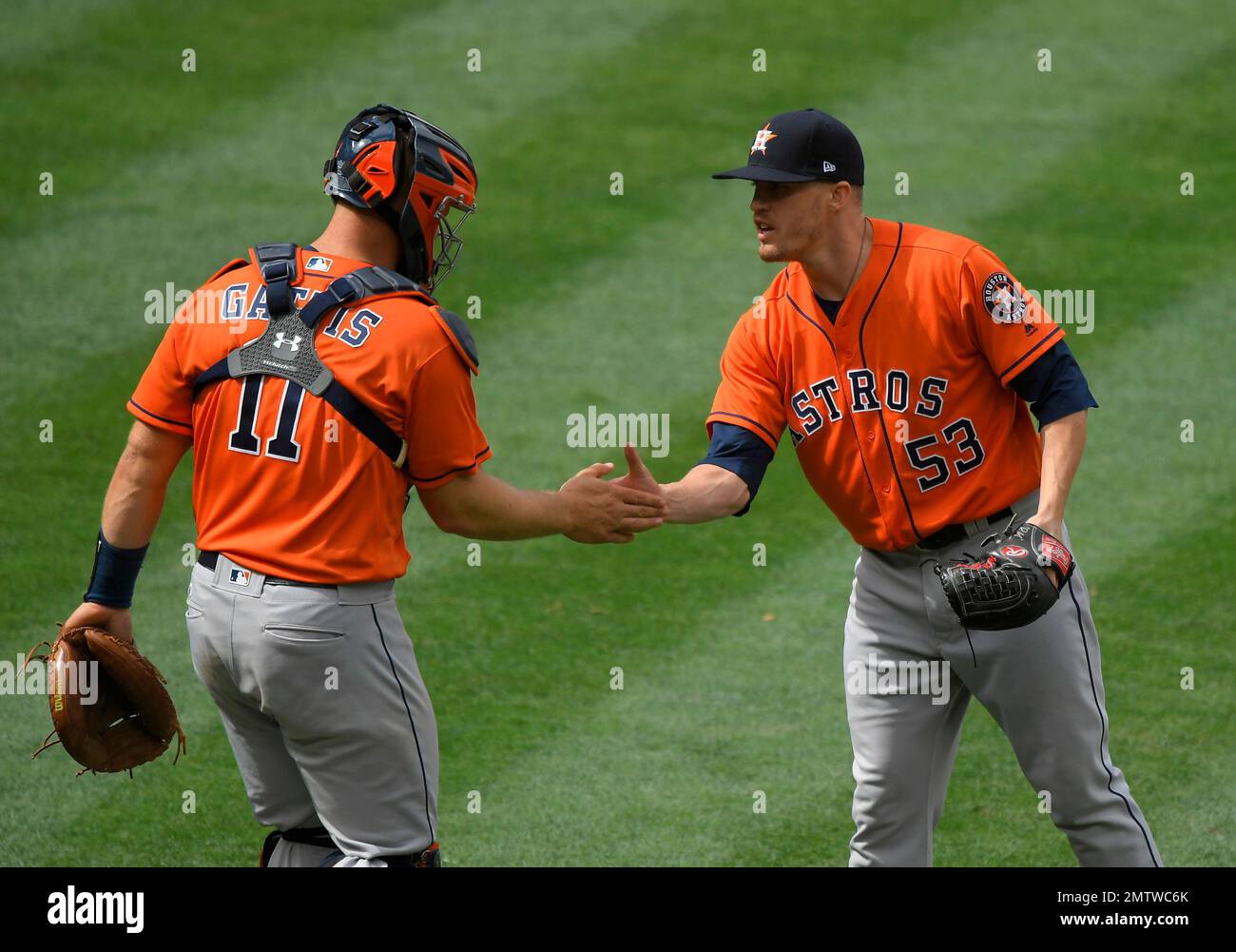 Houston Astros catcher Evan Gattis, left, and relief pitcher Ken Giles ...