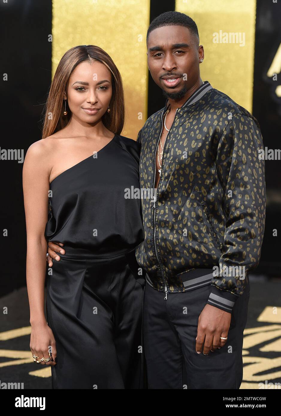 Kat Graham, left, and Demetrius Shipp Jr. arrive at the MTV Movie and ...