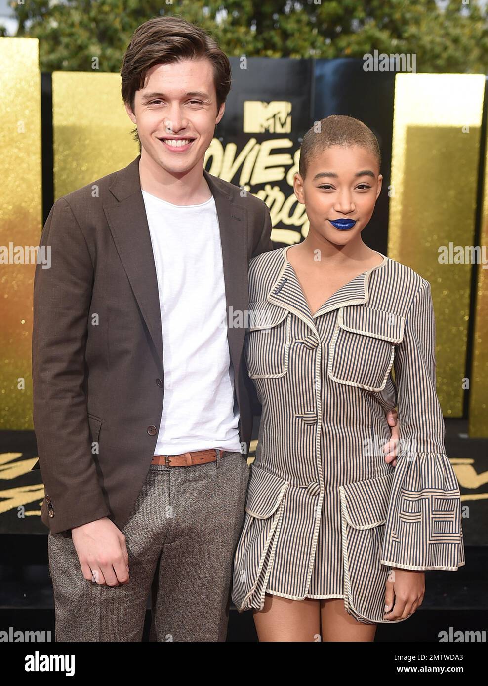 Nick Robinson, left, and Amandla Stenberg arrive at the MTV Movie and TV Awards at the Shrine ...
