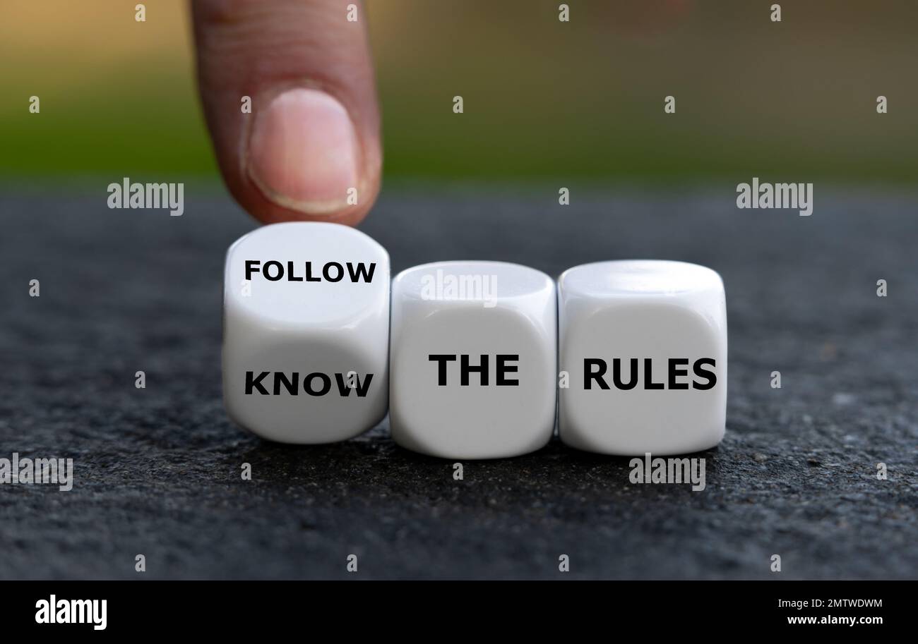 Hand turns dice and changes the expression 'know the rules'. to 'follow ...