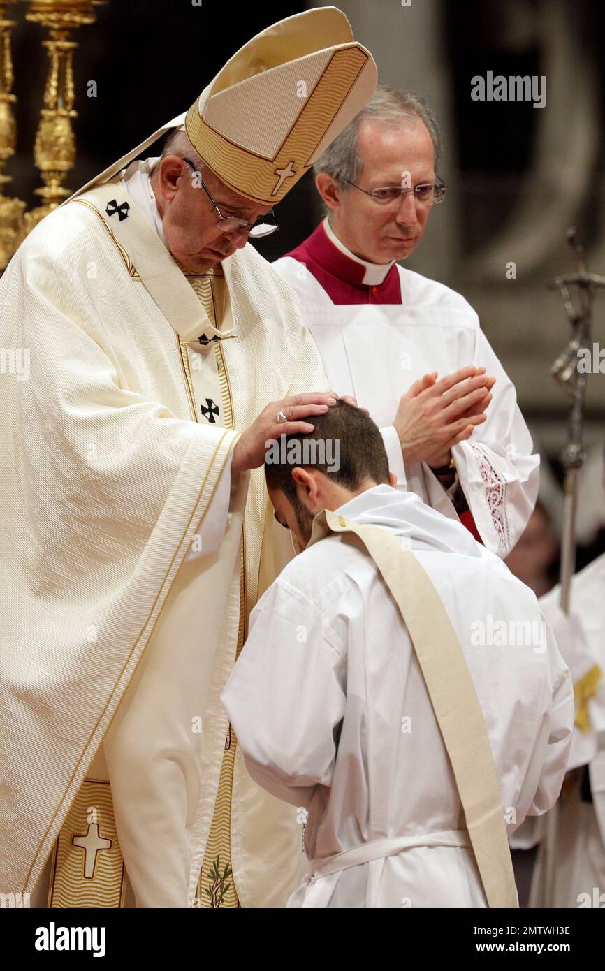 Pope Francis blesses one of the ten new priests that he ordained during ...