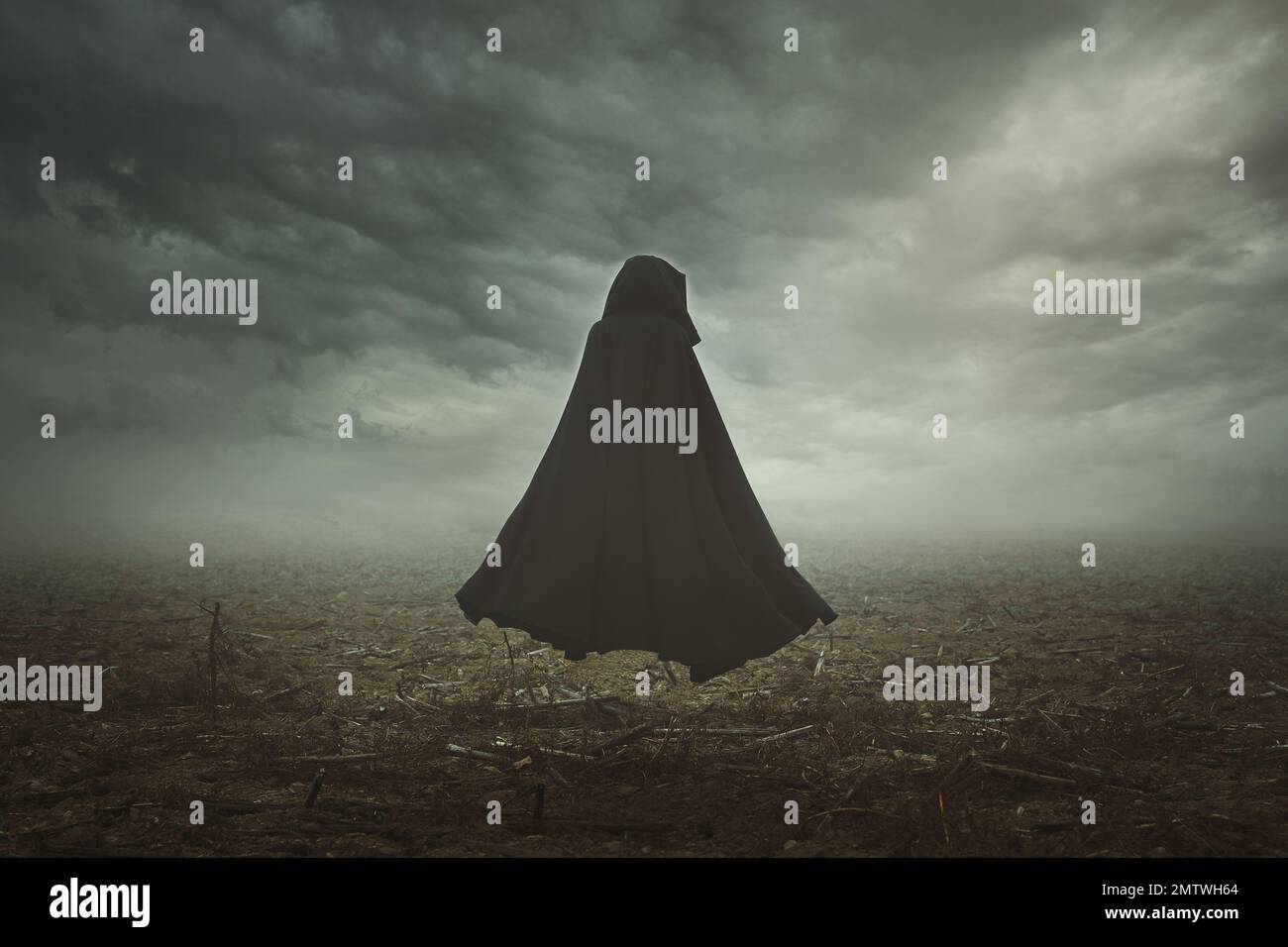 Mysterious figure in a desolate land Stock Photo - Alamy