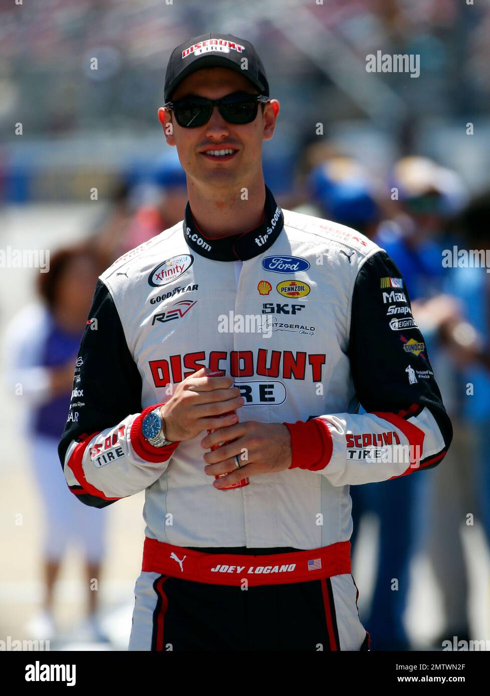 Joey Logano walks to his car before the start of the Sparks Energy 300 ...