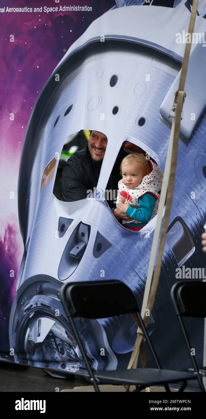 Tony Jost, left, holds his 18-month-old daughter, Kayla, as they pose ...