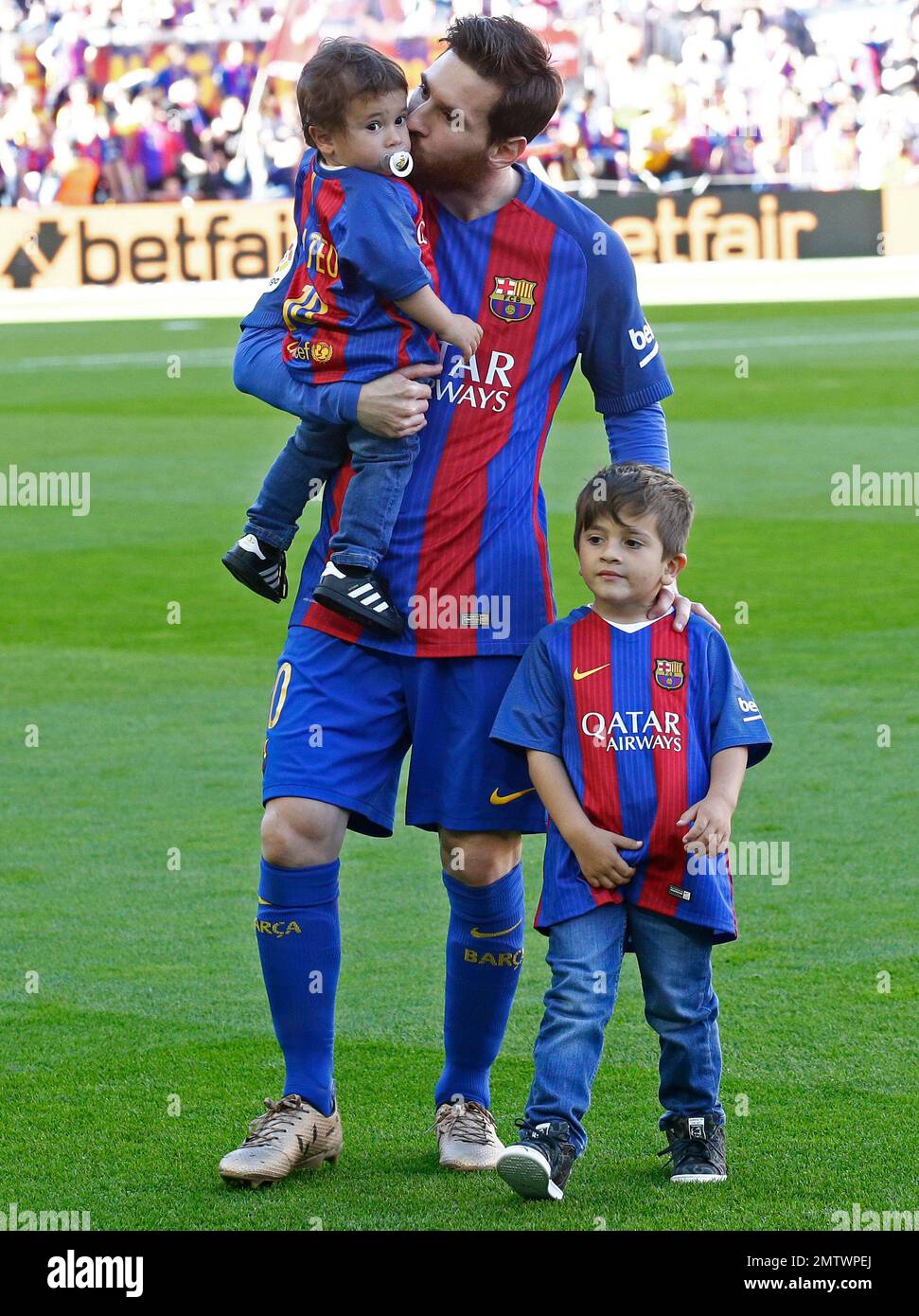 FC Barcelona's Lionel Messi, center, with his sons Mateo, left, and ...
