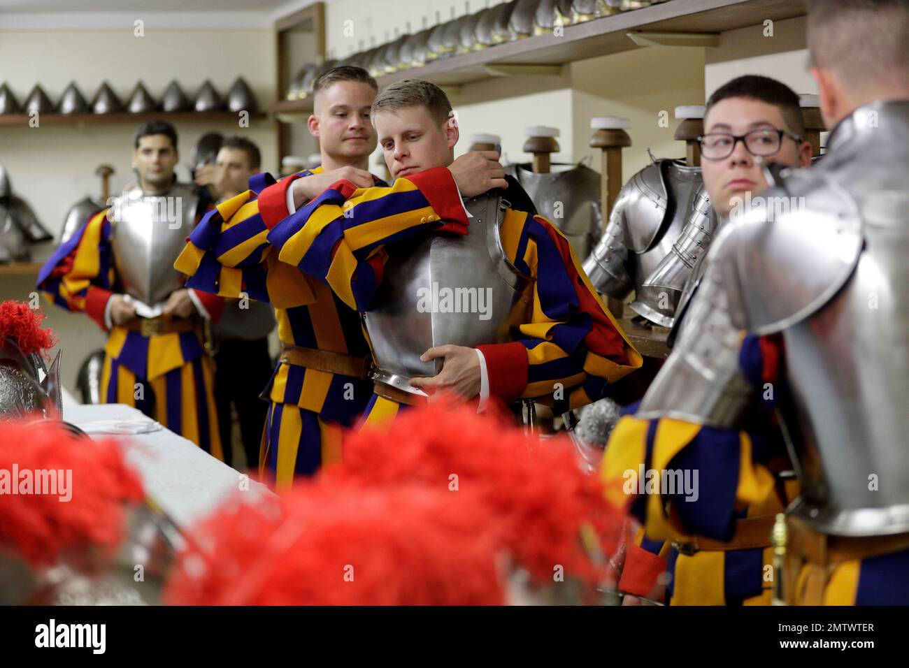 New Vatican Swiss Guards wear their uniforms and armors prior to a ...