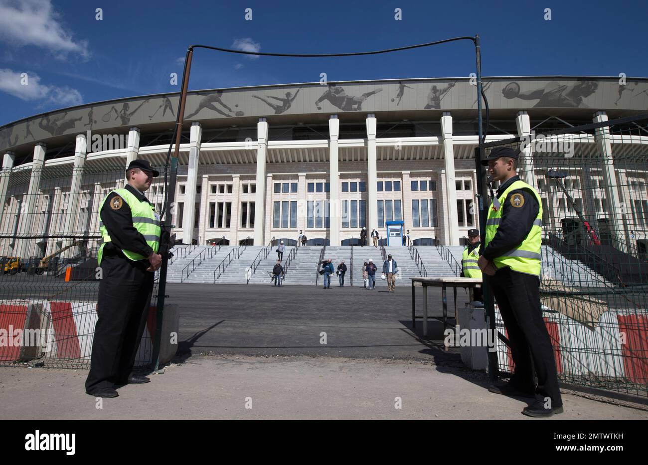 Security guard stand at an entrance to the Luzhniki stadium, which is ...