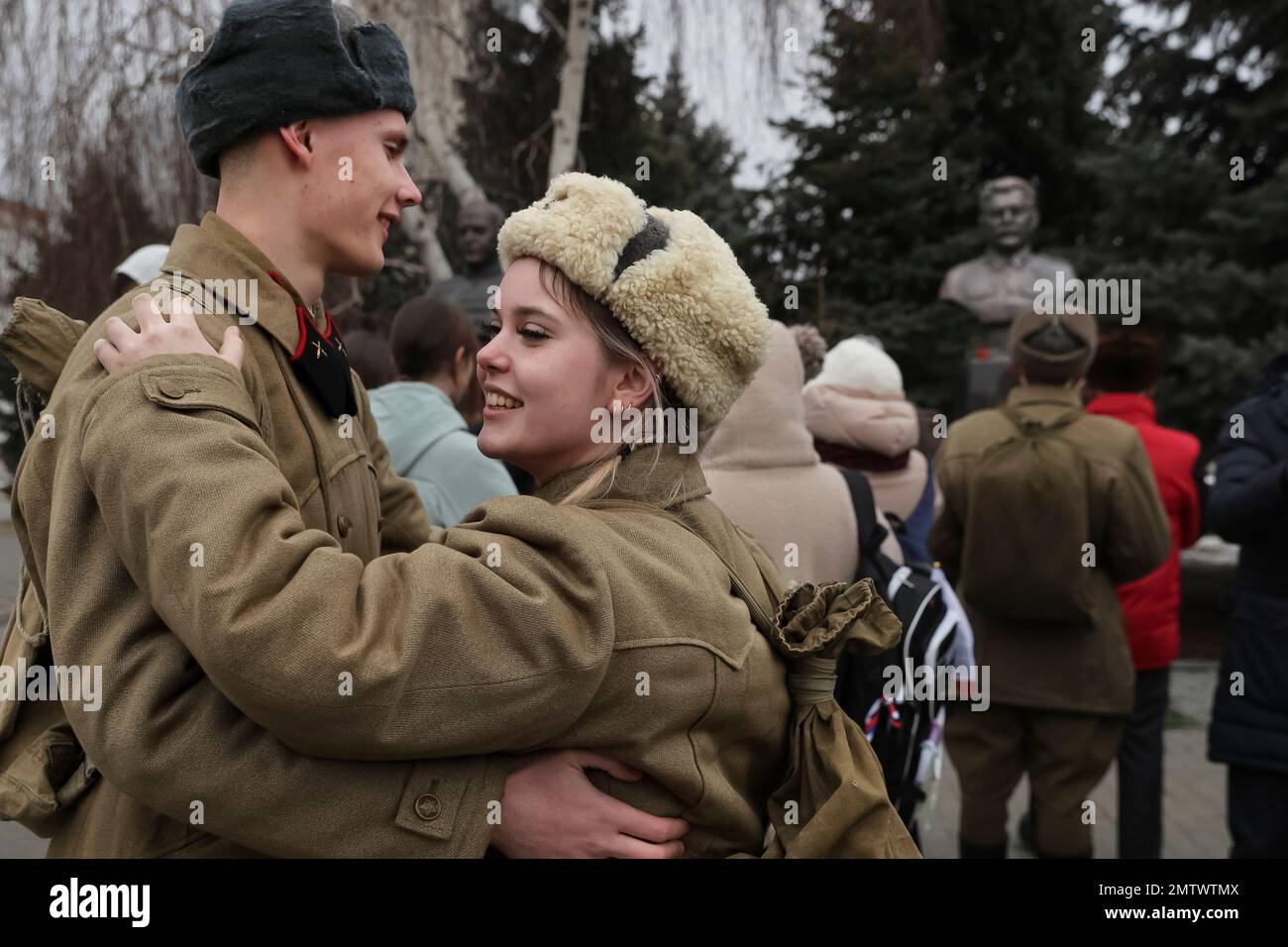 A couple dressed in Red Army World War II winter uniforms dance as they ...