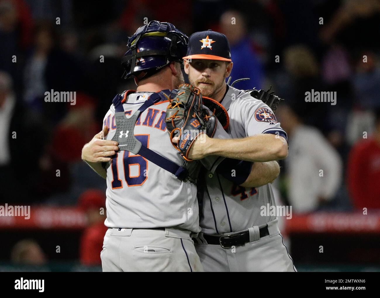 Houston Astros relief pitcher Chris Devenski, right, hugs catcher Brian ...