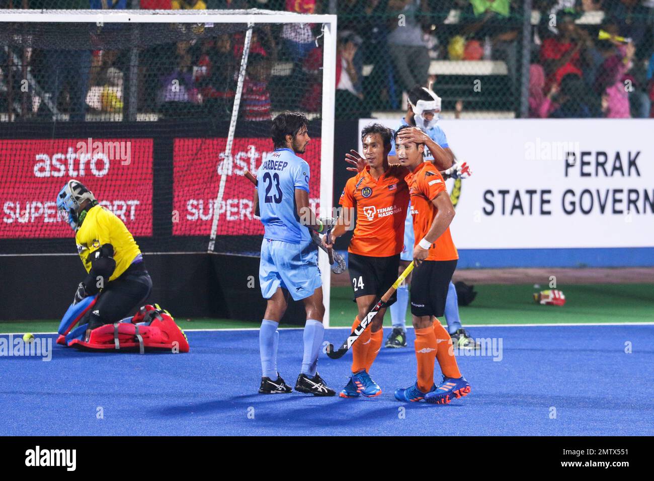 Malaysia's Tengku Ahmad, right, celebrates with his teammate Muhd ...