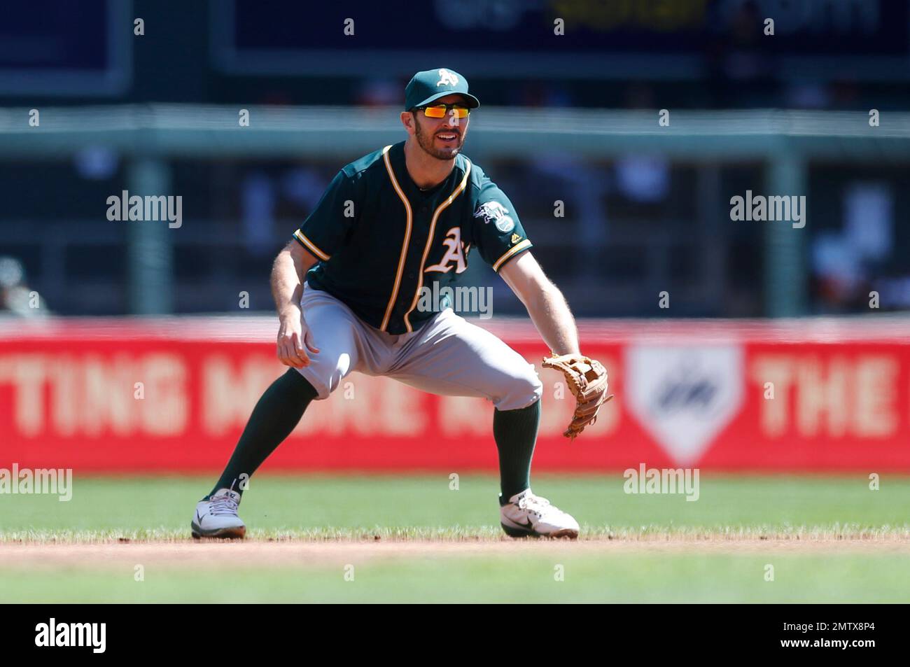 Oakland Athletics shortstop Adam Rosales defends third base against the ...