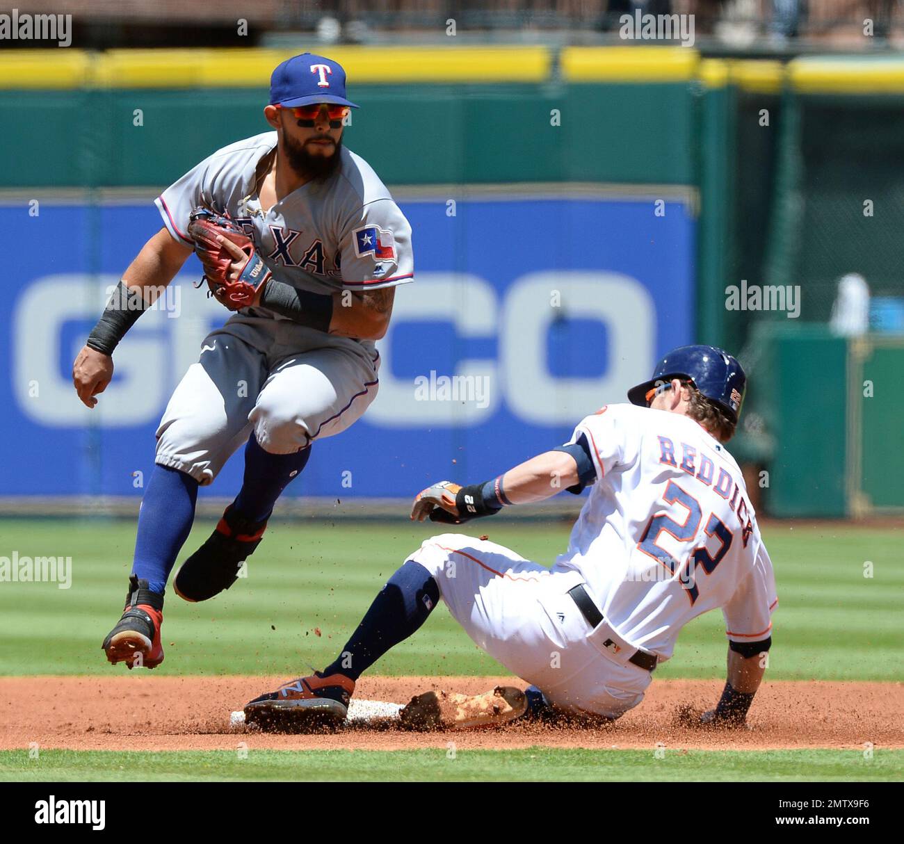 Houston Astros' Josh Reddick (22) slides into second base keeping Texas ...