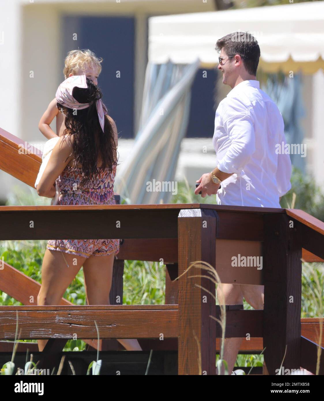 Robin Thicke and wife Paula Patton come down to collect their son ...