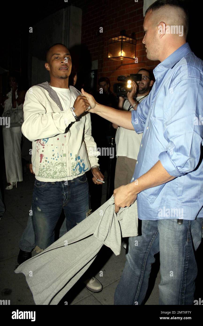Rapper Ti leaves Mr. Chow and signs autographs and hugs a soldier on ...