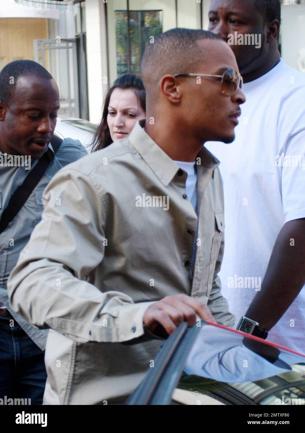 Rapper T.I. leaves the Louis Vuitton store after some shopping in ...