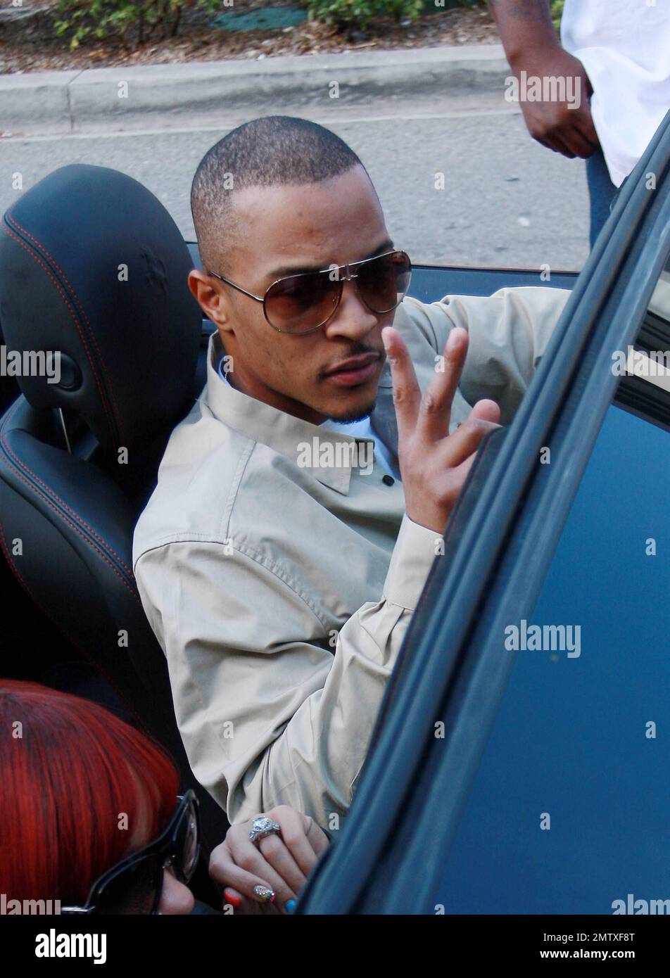 Rapper T.I. leaves the Louis Vuitton store after some shopping in ...