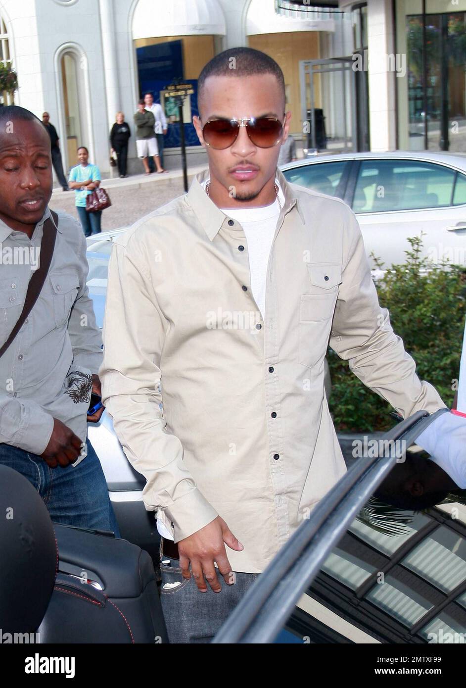 Rapper T.I. leaves the Louis Vuitton store after some shopping in ...