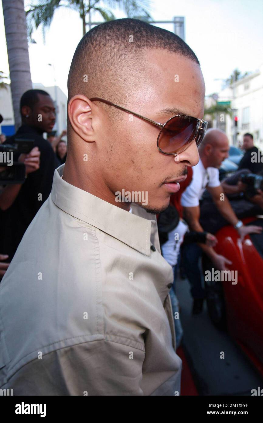 Rapper T.I. leaves the Louis Vuitton store after some shopping in ...