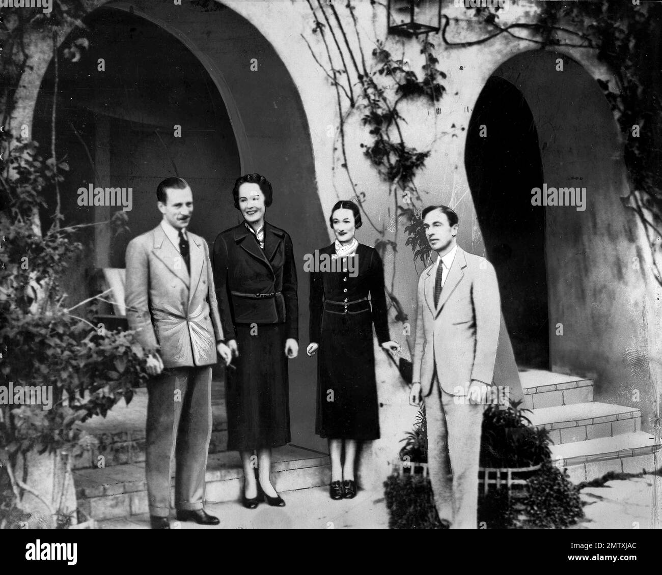 Wallis Simpson, second from right, poses for photographers at the ...
