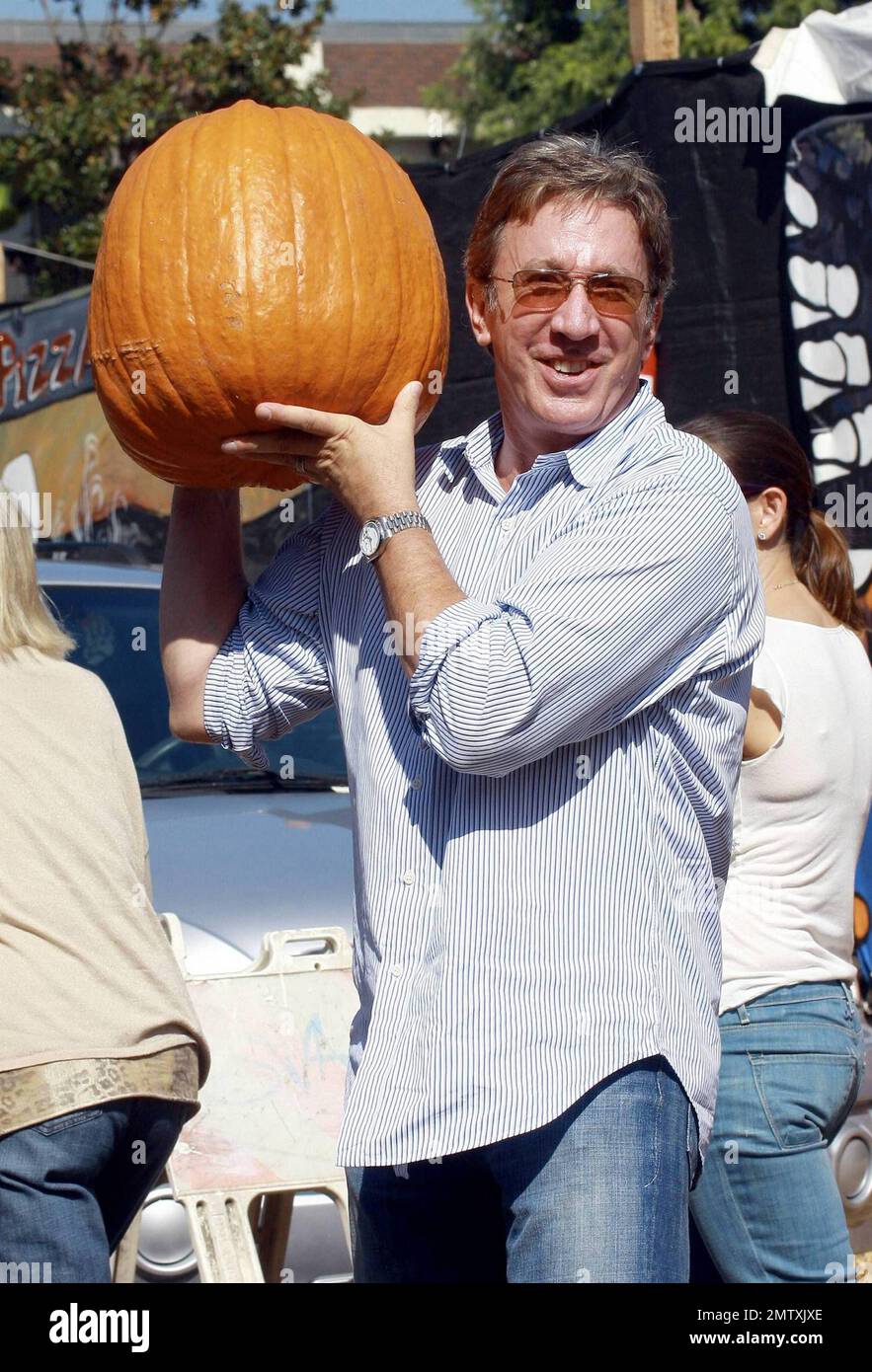 Actor Tim Allen shows off the pumpkin he's chosen for Halloween after ...