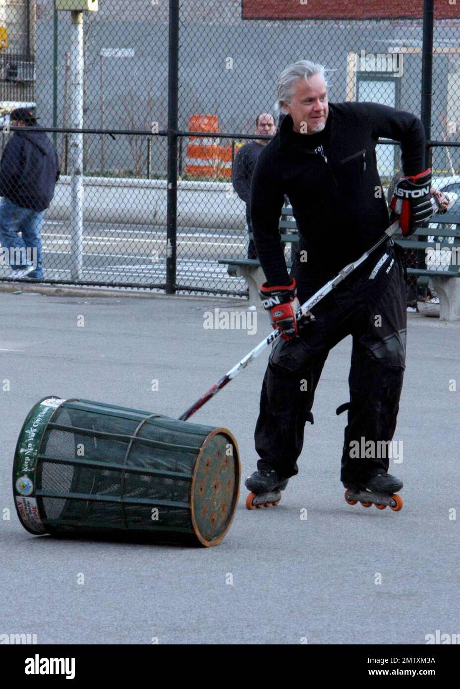Actor Tim Robbins gets in a game of roller hockey with a group of ...