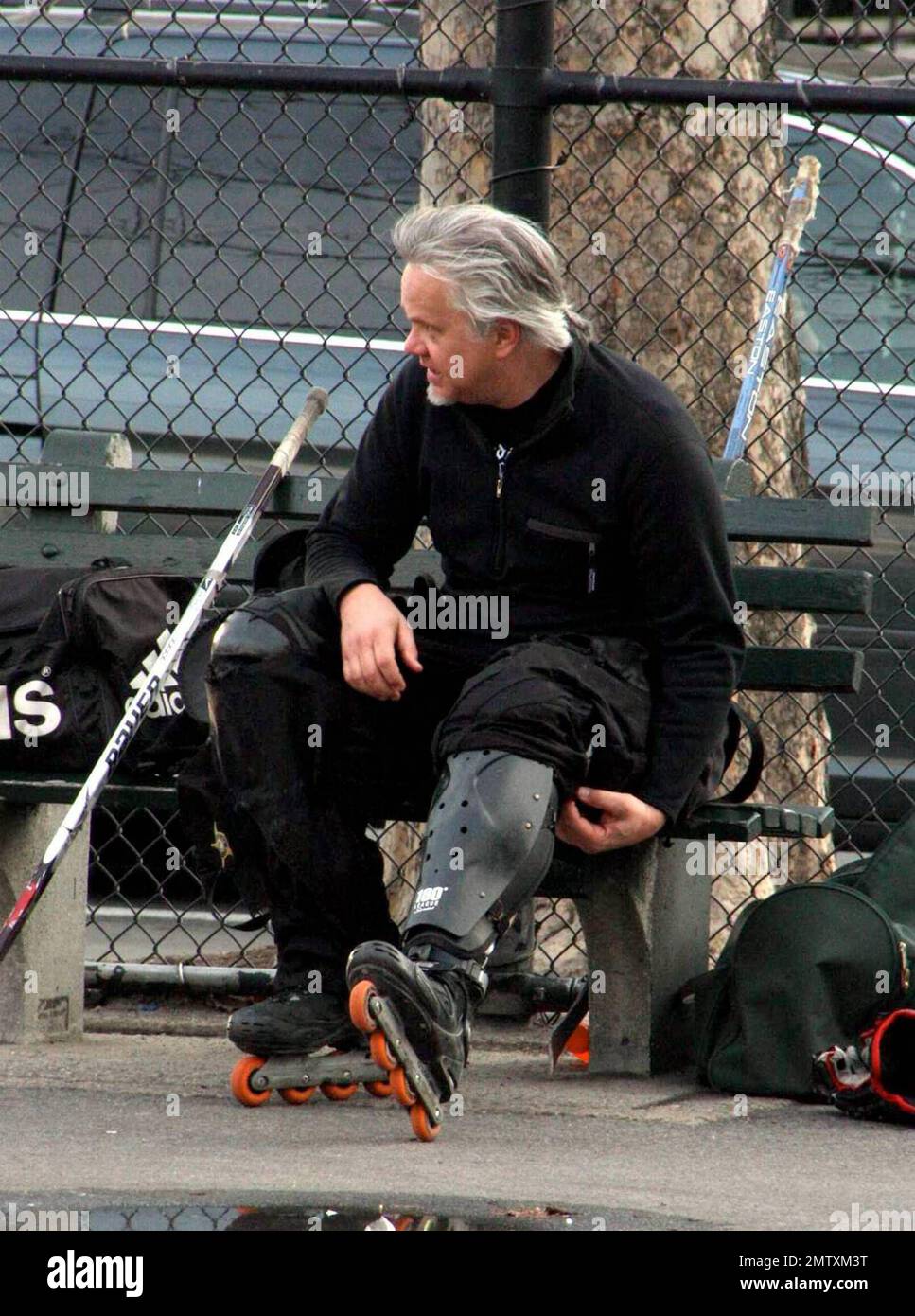 Actor Tim Robbins gets in a game of roller hockey with a group of ...