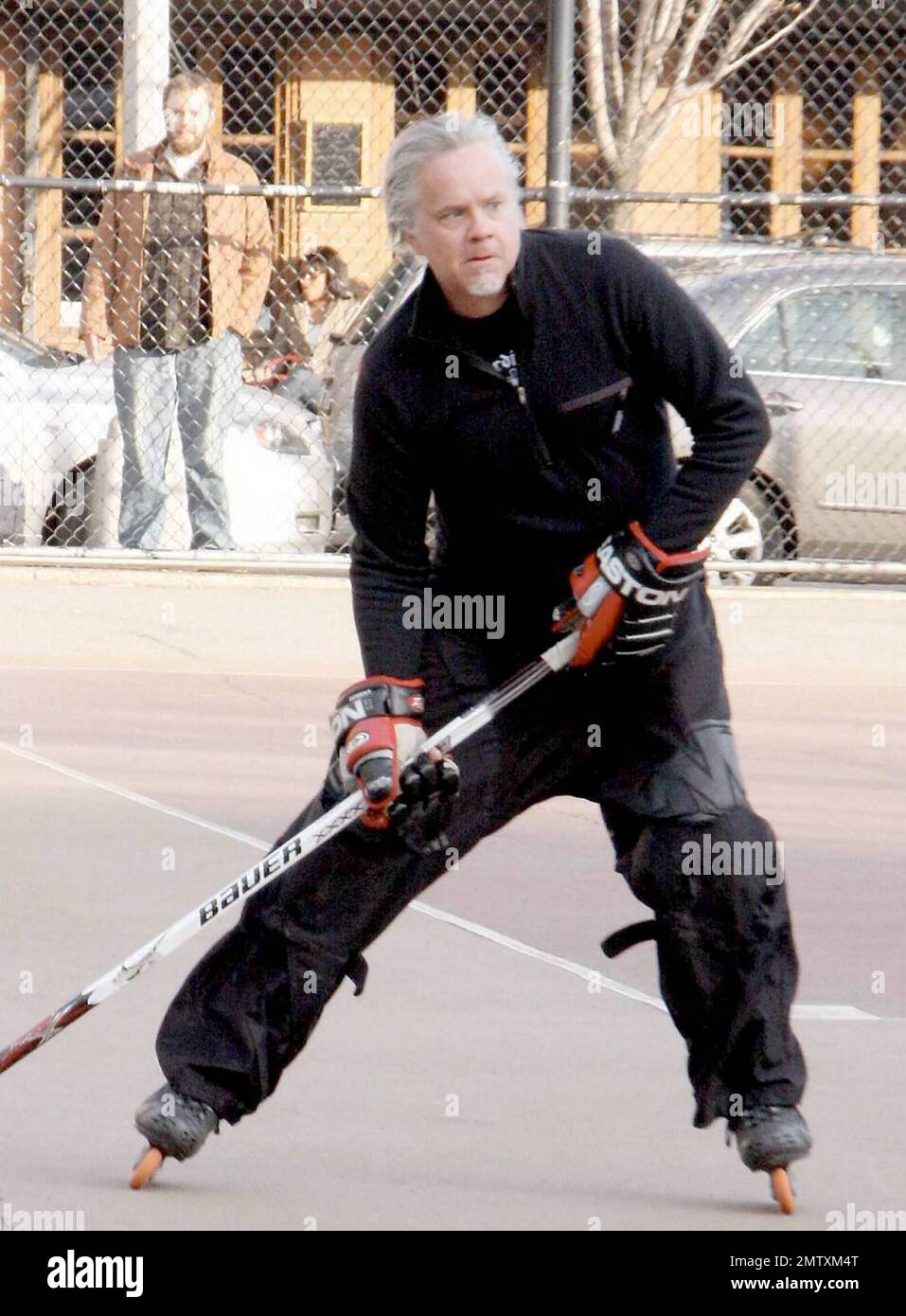 Actor Tim Robbins gets in a game of roller hockey with a group of ...