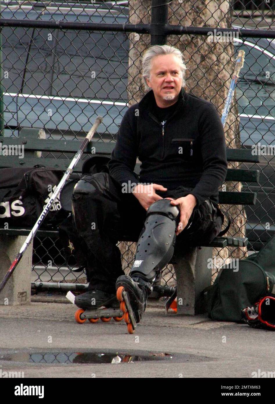 Actor Tim Robbins gets in a game of roller hockey with a group of ...