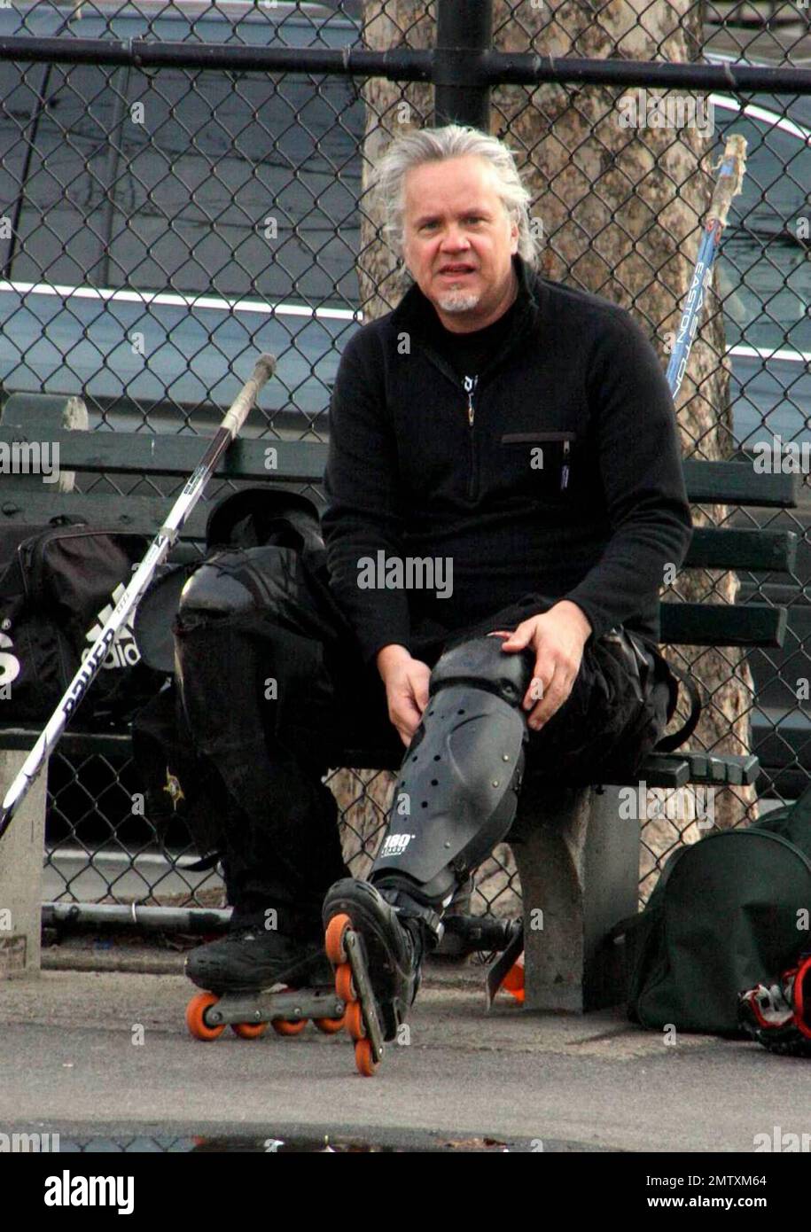 Actor Tim Robbins gets in a game of roller hockey with a group of ...