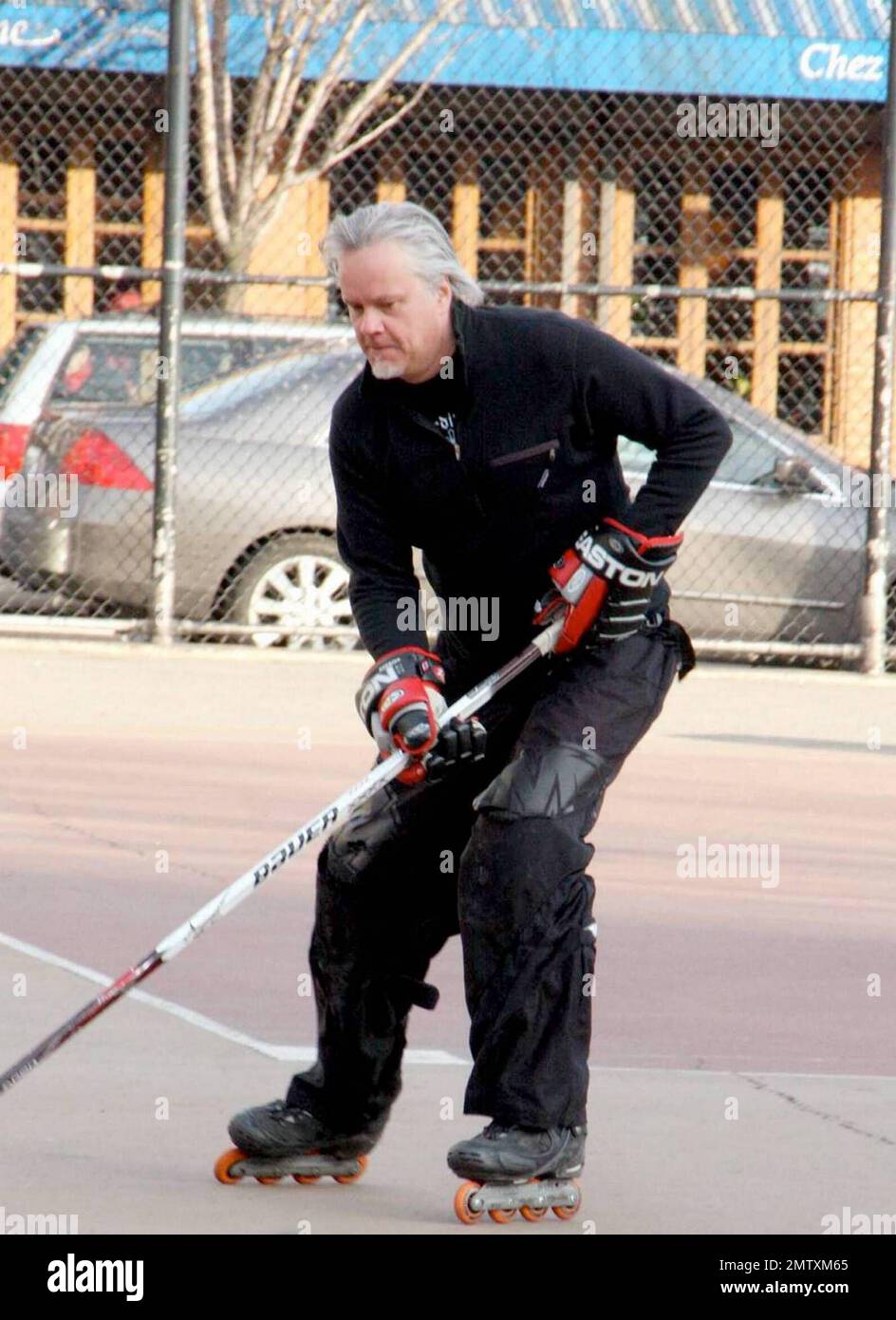 Actor Tim Robbins gets in a game of roller hockey with a group of ...