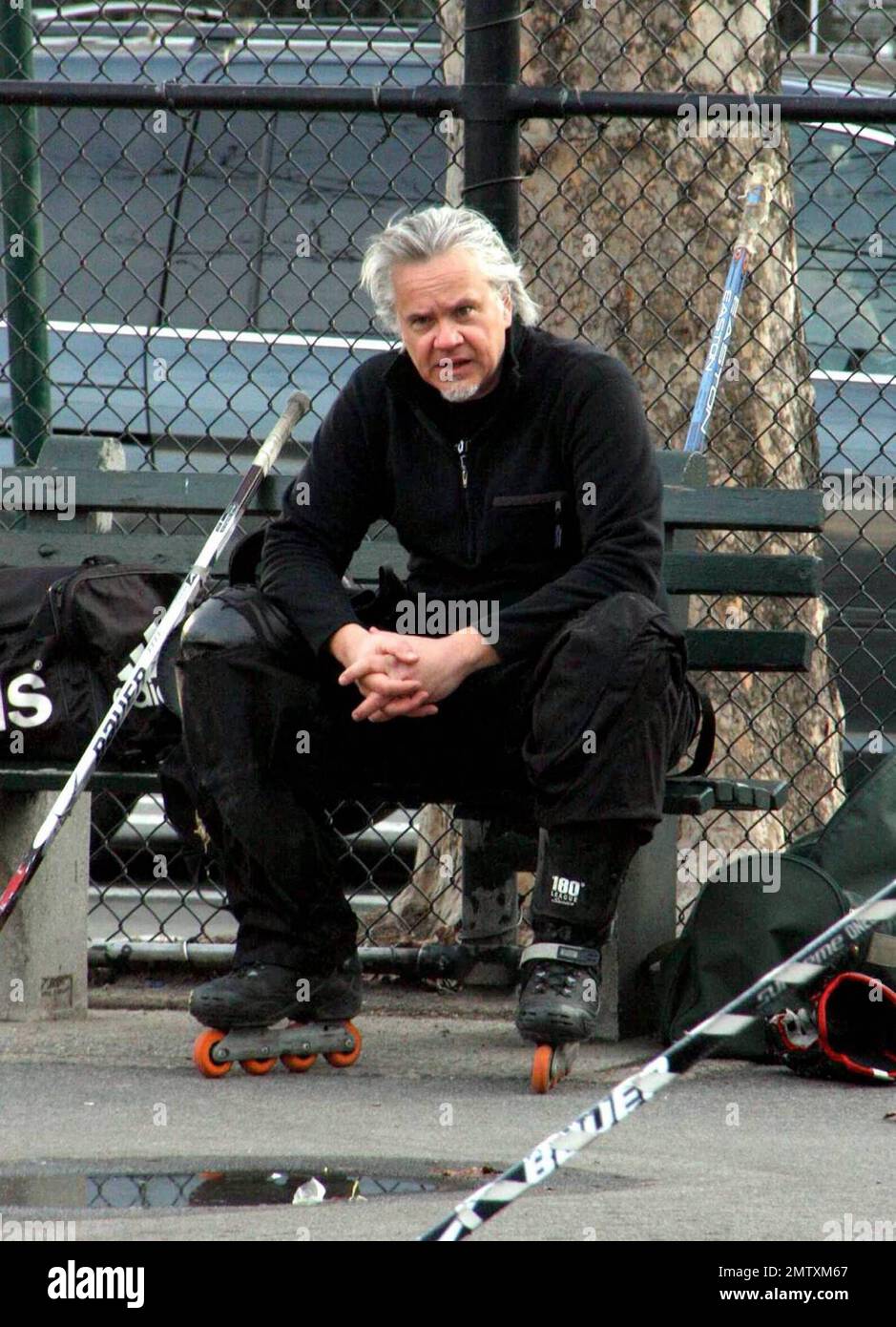 Actor Tim Robbins gets in a game of roller hockey with a group of ...