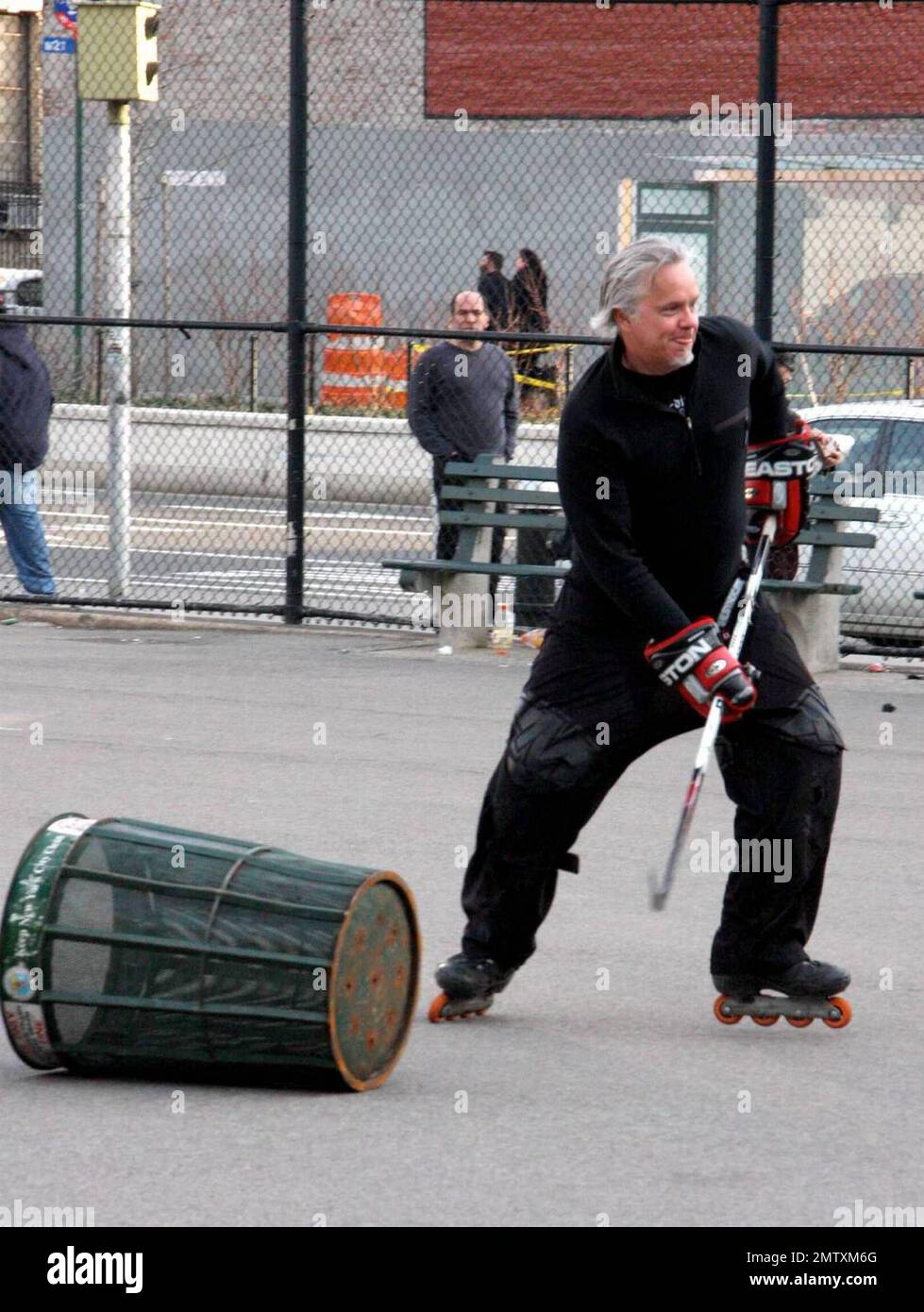 Actor Tim Robbins gets in a game of roller hockey with a group of ...