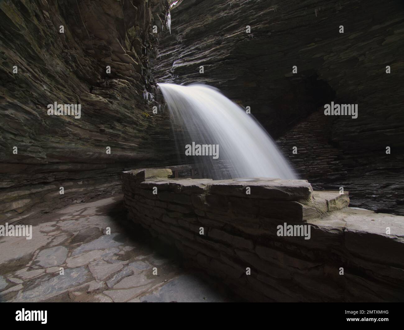pathway behind a waterfall called cavern cascade at watkins glen state ...