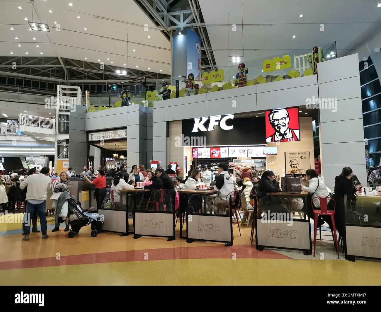 Horizontal image of the premises and terrace with tables of the chicken ...