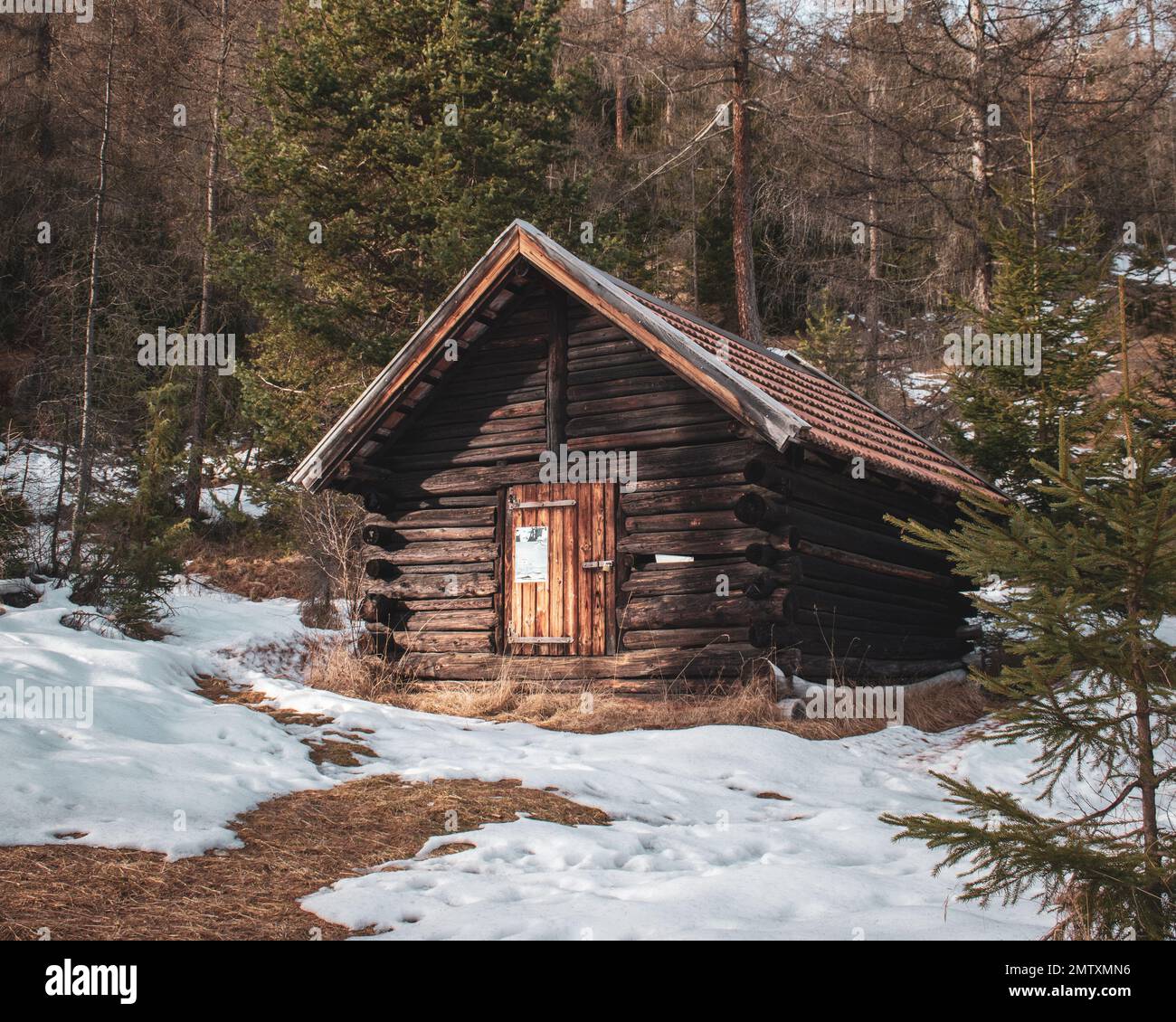 old wooden hut cabin in mountain alps at rural Winter landscape Stock ...