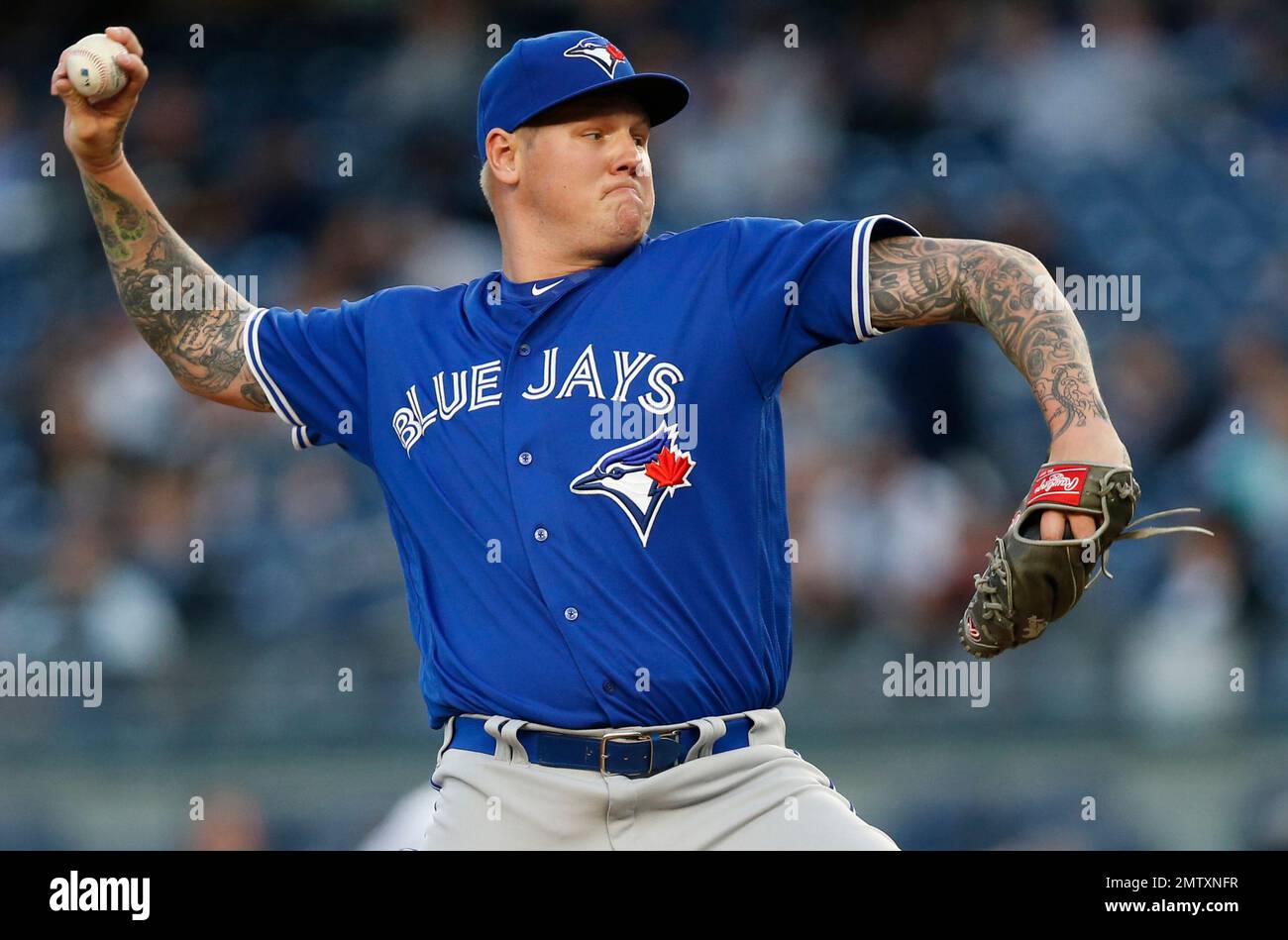 Toronto Blue Jays starting pitcher Mat Latos delivers during the first ...