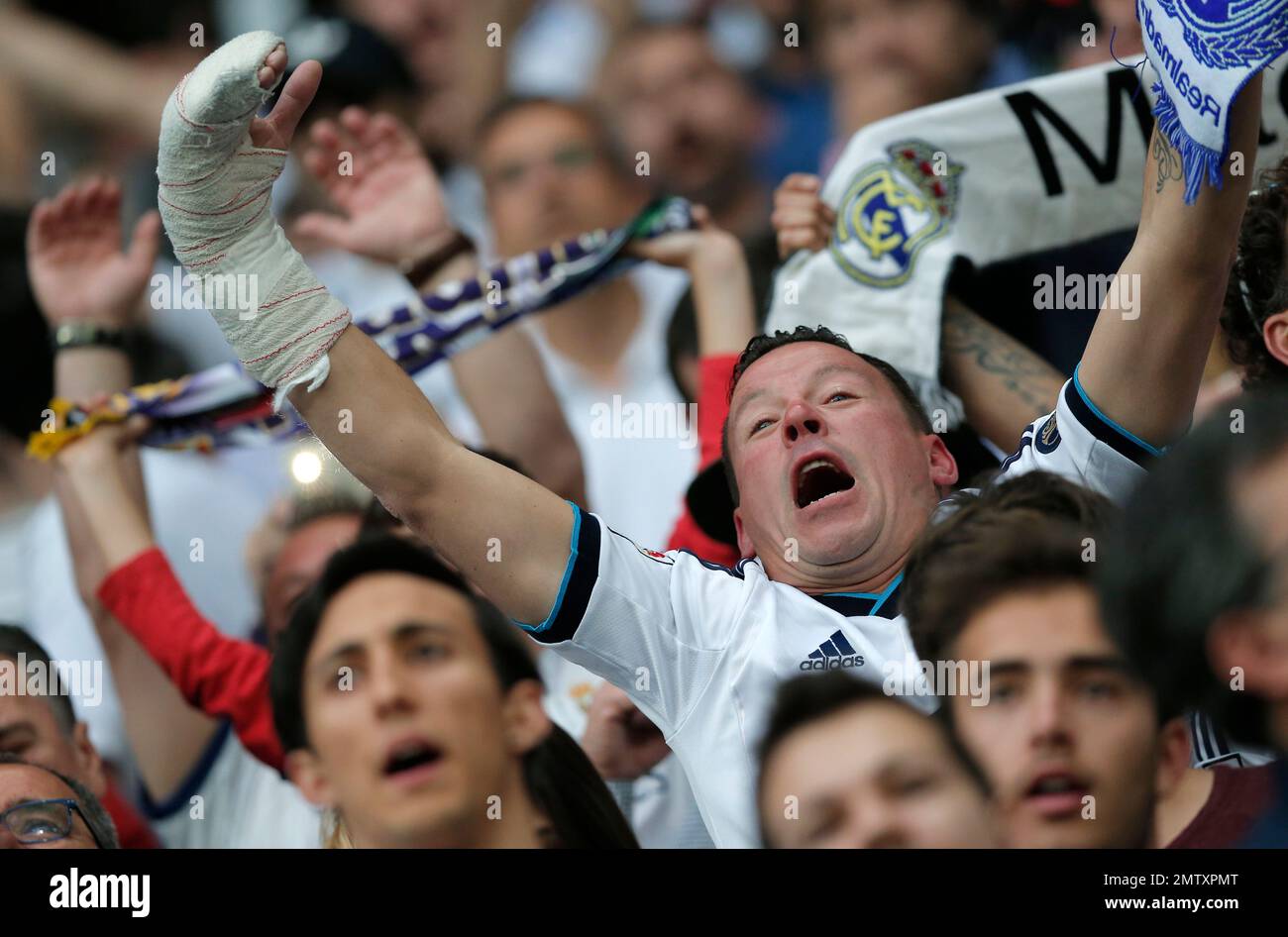 Real Madrid supporters cheer during the Champions League semifinals ...