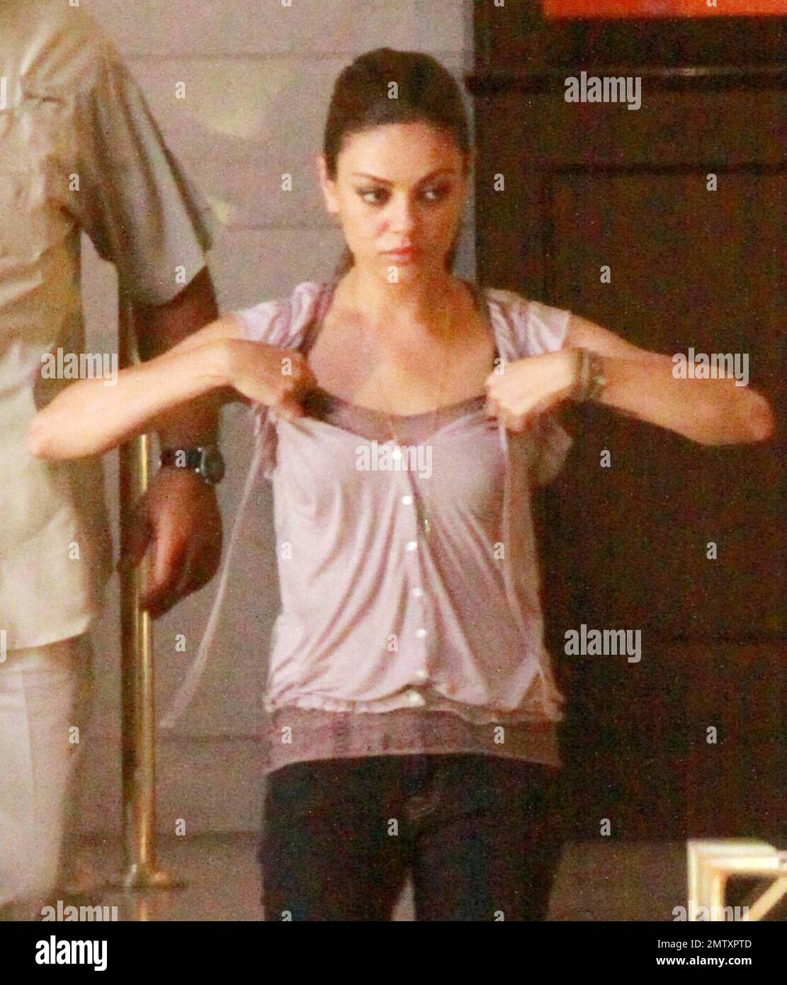 Justin Timberlake and Mila Kunis film scenes with a large dancing, arm ...