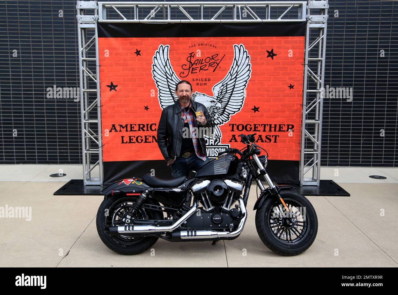 IMAGE DISTRIBUTED FOR HARLEY-DAVIDSON - Artist Oliver Peck shows off ...