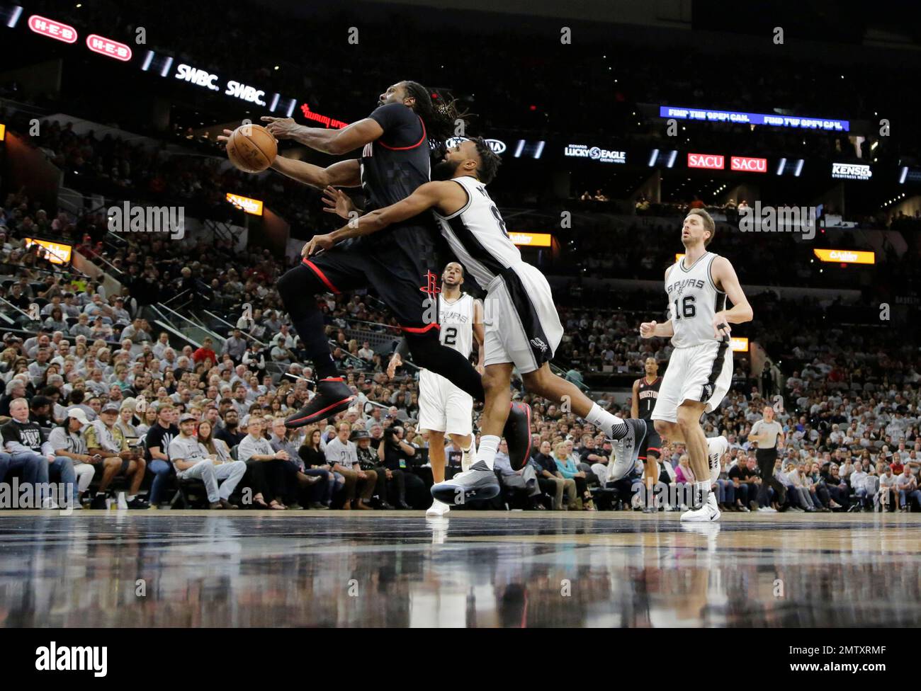 Houston Rockets center Nene Hilario (42) is fouled by San Antonio Spurs ...