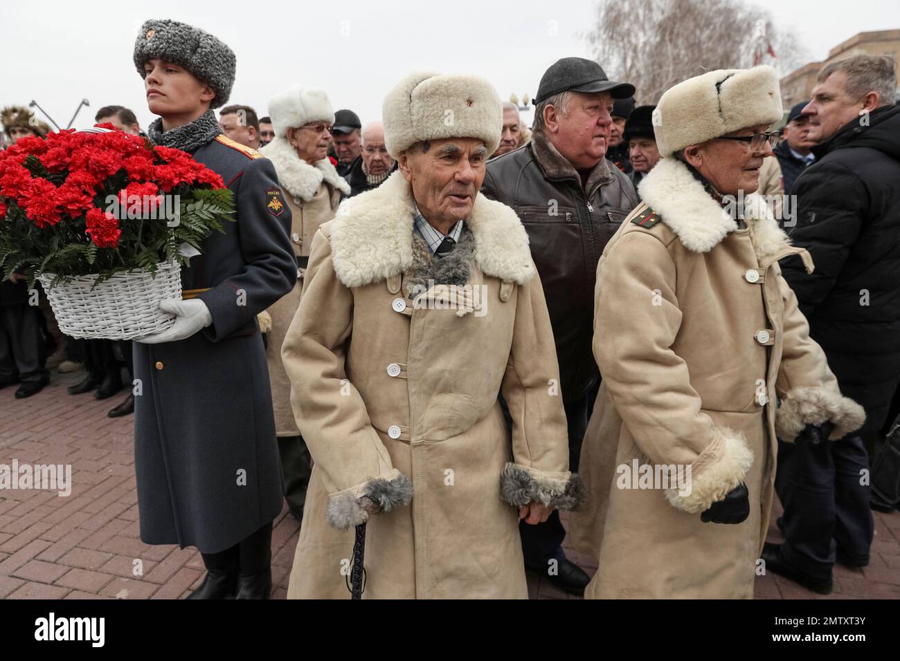 A group of Soviet veterans dressed in Red Army World War II winter ...