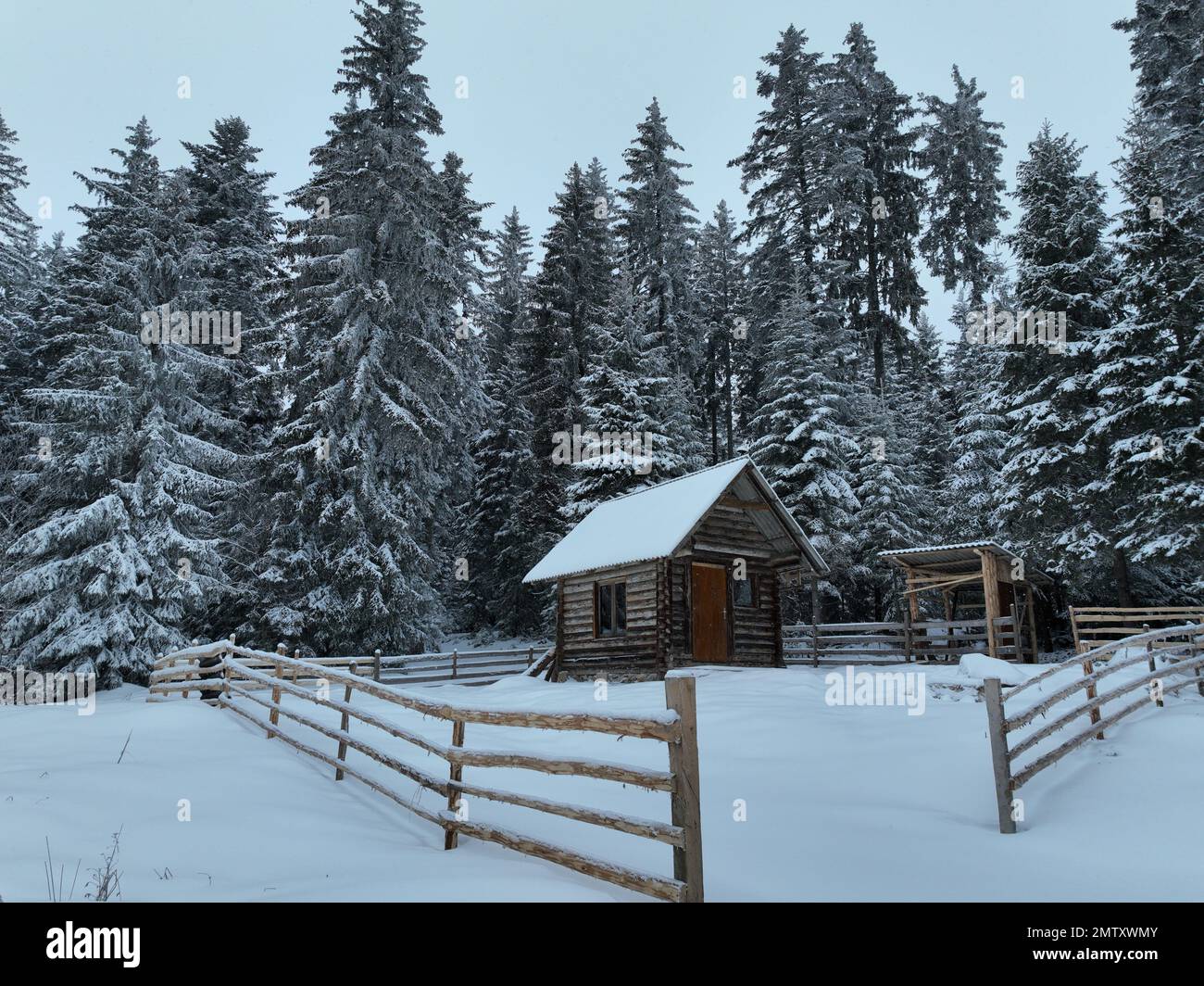 Splendid mountain winter landscape with secluded small wooden alpine ...