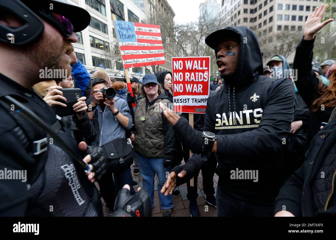 Protesters argue during a May Day protest, Monday, May 1, 2017, in ...