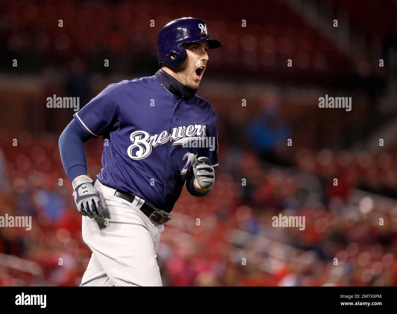 Milwaukee Brewers' Travis Shaw celebrates as he rounds the bases after ...