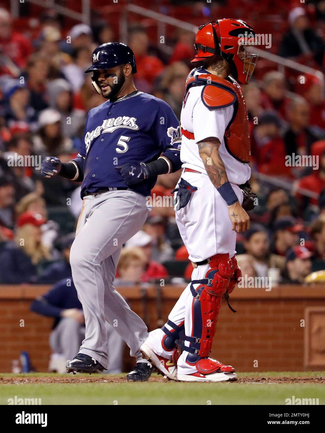 Milwaukee Brewers' Jonathan Villar (5) scores past St. Louis Cardinals ...