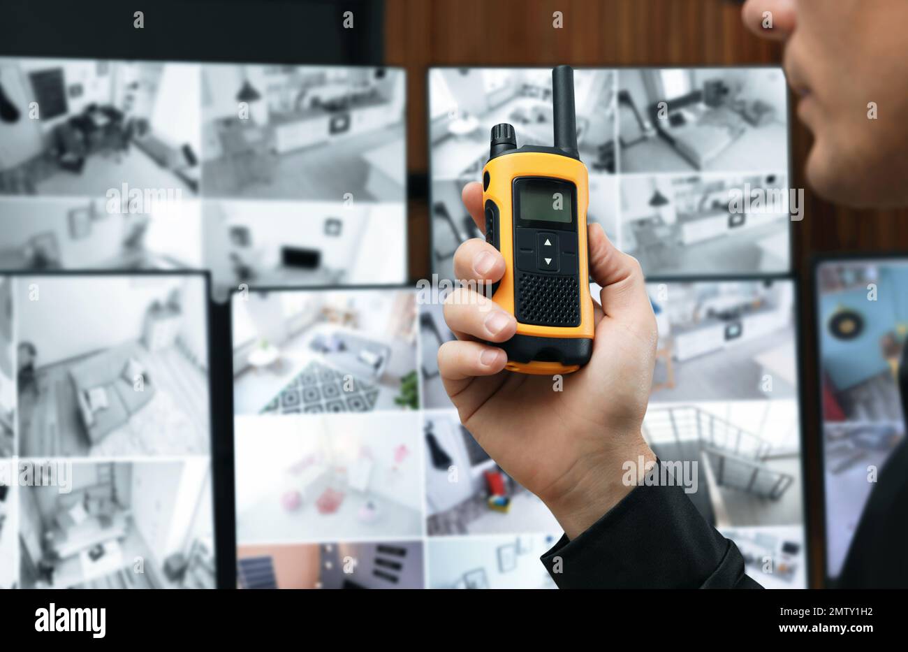 Security guard using portable transmitter at workplace, closeup Stock ...