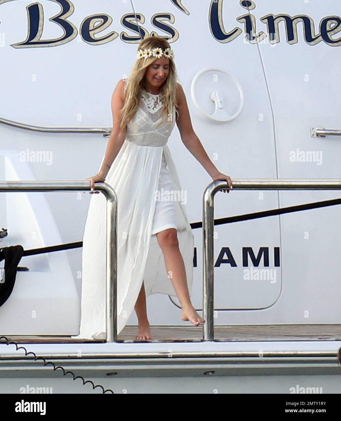 Bride to be Ashley Tisdale wears a white bride style dress with a ...