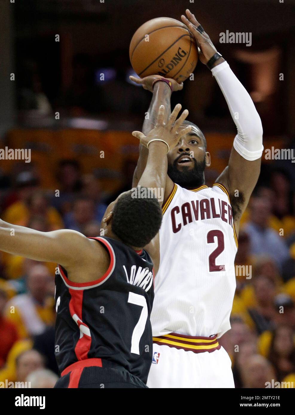 Cleveland Cavaliers' Kyrie Irving (2) shoots over Toronto Raptors' Kyle ...