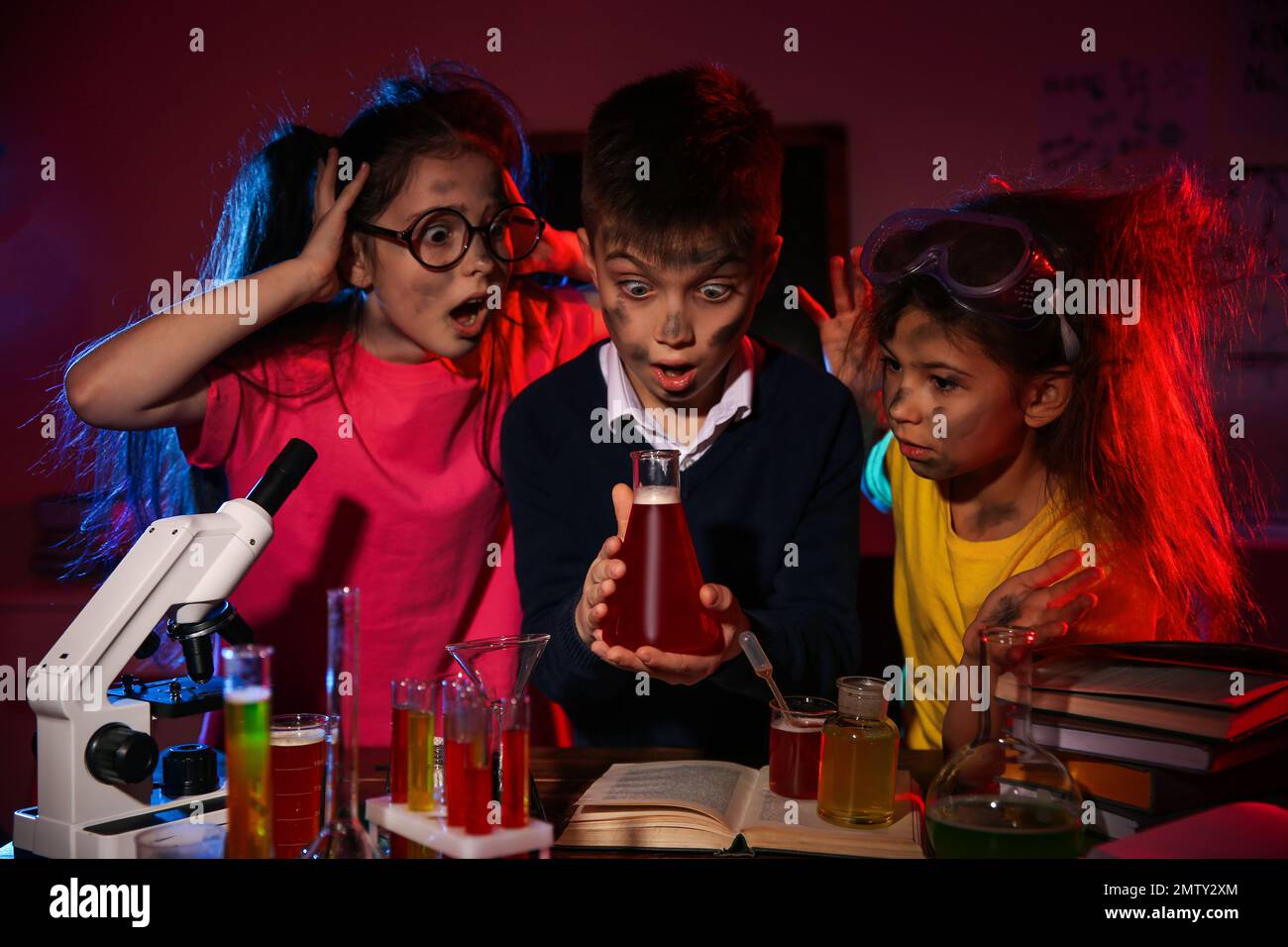 Children doing chemical research in laboratory. Dangerous experiment ...
