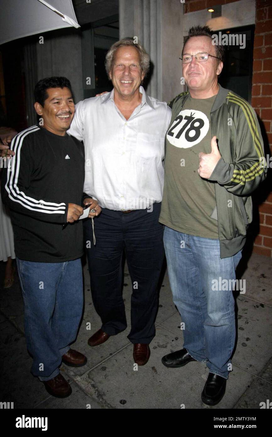 Tom Arnold quickly pulls up a seat with Steve Tisch and his family at ...